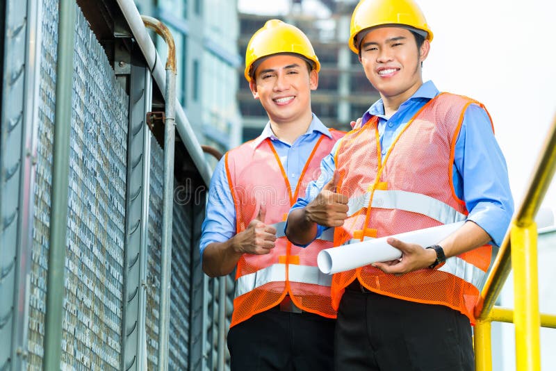Asian Indonesian Construction Workers on Building Site Stock Photo ...