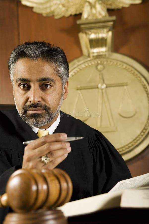 Judge Noting Important Points in Courtroom Stock Photo - Image of book ...