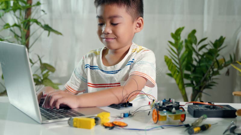 Asian Kid Boy Learns Coding and Programming with Laptop for Arduino ...