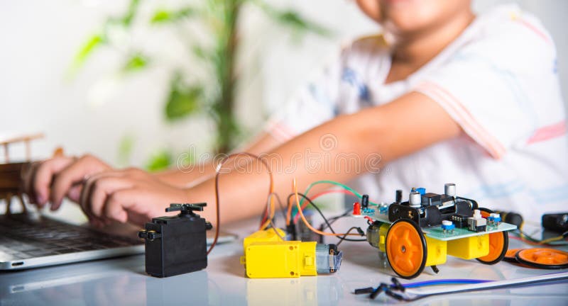 Asian Kid Boy Learns Coding and Programming with Laptop for Arduino ... Asian Kid Boy Learns Coding and Programming with Laptop for Arduino ...