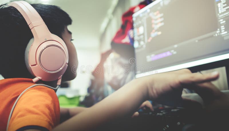 Asian Kid Coding and Scripting Program on on His Game Streaming Desktop ...