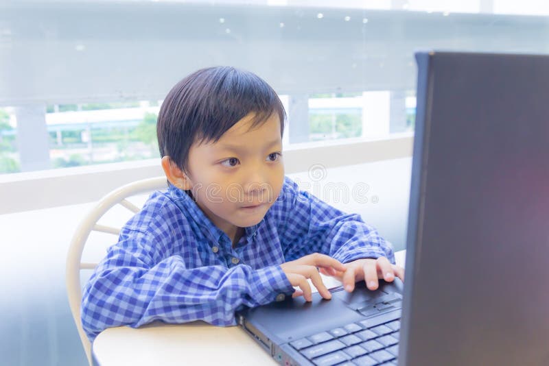 Asian kid with laptop stock image. Image of delighted - 39573063
