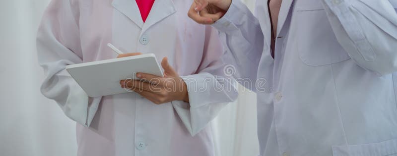 Asian Kid Learning with Scientist in the Laboratory. Physical ...