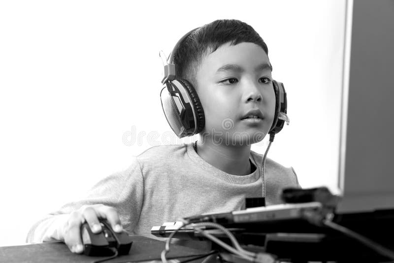 Asian Kid Play Computer Games (black and White) Stock Photo - Image of ...