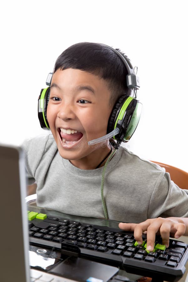 Asian Kid Play Computer Games with Yelling Face Stock Photo - Image of ...