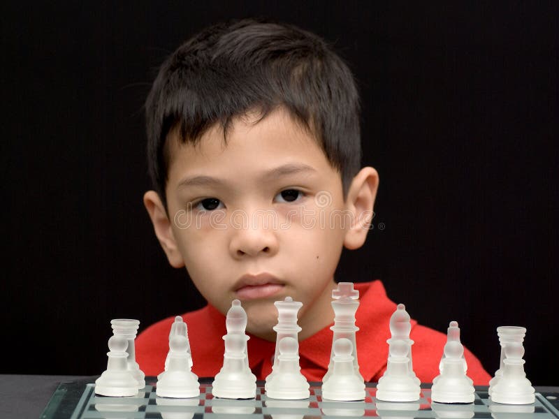 Asian kid playing chess stock image. Image of pawn, moving - 7207061