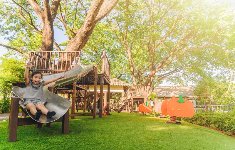 Asian Kid Playing Slide at the Playground Stock Photo - Image of girls ...