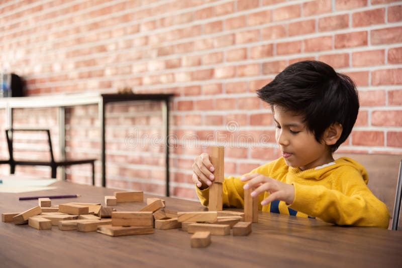 Asian Kids are Playing Wooden Block Stacks Game Together. Stock Image ...