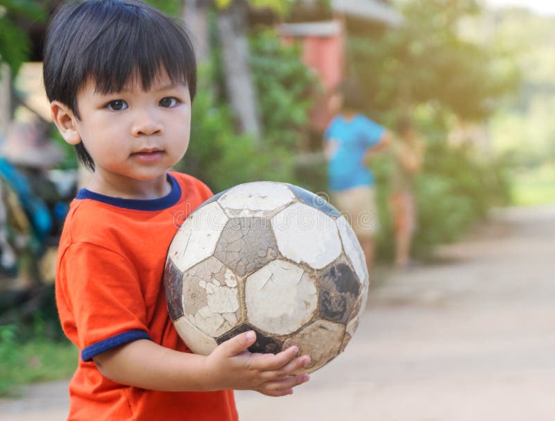 Asian Kid in Poor Village Playing with Soccer Ball Stock Photo - Image ...
