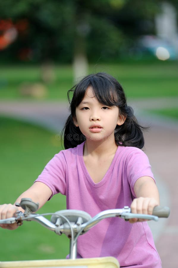 Asian kid riding bike stock image. Image of recreation - 25563873