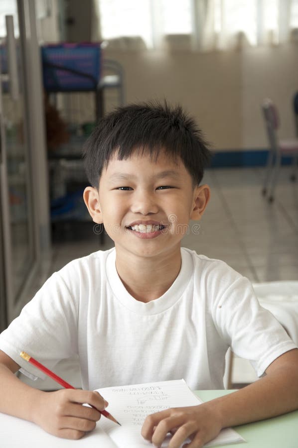 Asian Kid Smile in Class Room Stock Photo - Image of classmate, desk ...