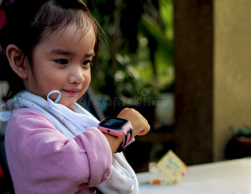 Asian Kid Use Technology Smart Watches with Happy Faces Stock Photo ...
