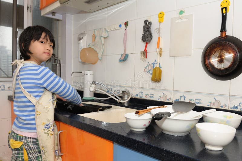 Asian kid washing dishes stock photo. Image of bowl, chores - 17387232
