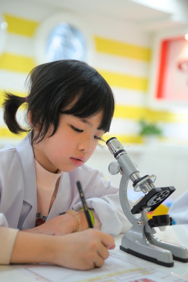 Asian kid writing report stock image. Image of learning - 18573023
