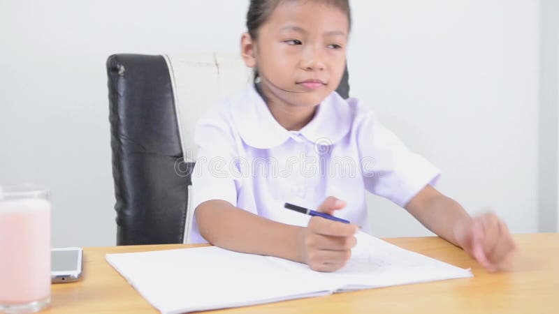 Asian Kids - Thai Girl in Student Uniform Writing Notebook Stock ...