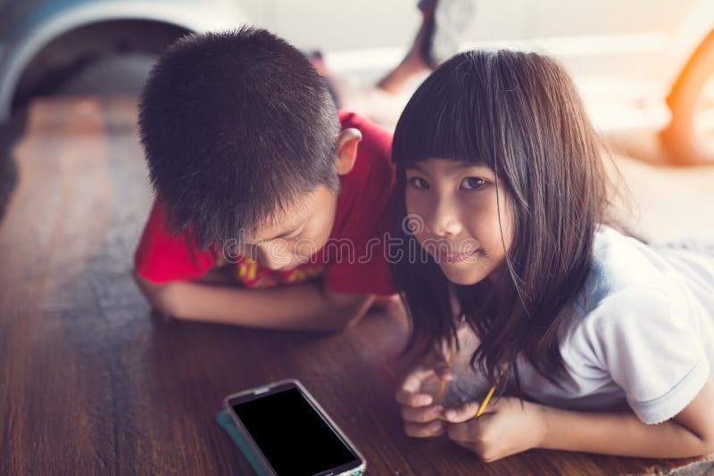 Asian Kids Using Smartphone Together. Stock Photo - Image of cheerful ...