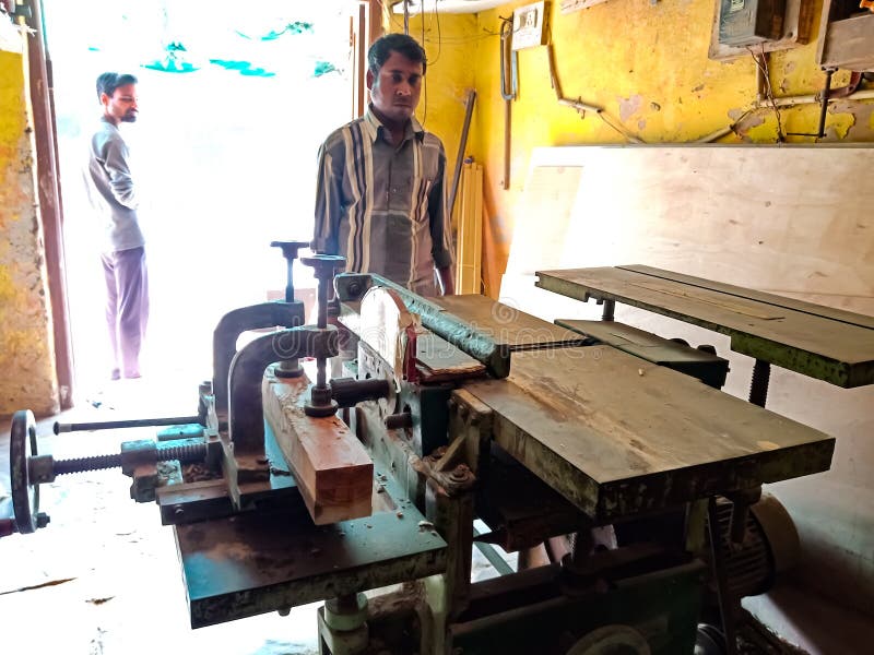 Asian Labour Stand in Front of Wood Chopping Machine at Workshop in ...