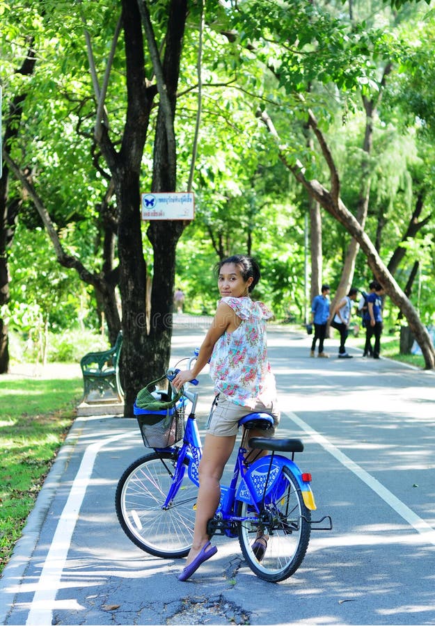 Asian lady riding bicycle stock photo. Image of beauty - 36945726