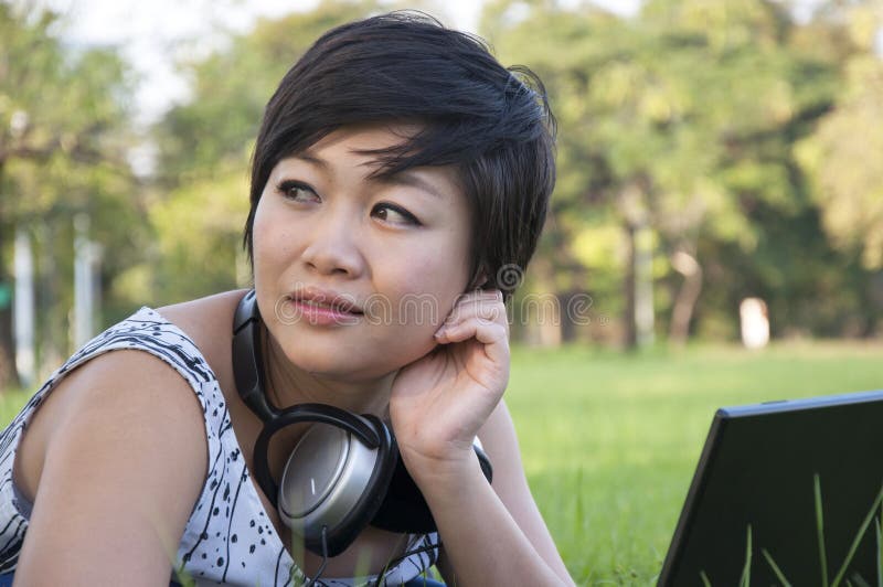 Asian lady using computer stock photo. Image of young - 22530672