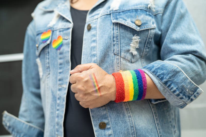 Asian Lady Wearing Rainbow Flag Wristbands Symbol Of Lgbt Pride Month