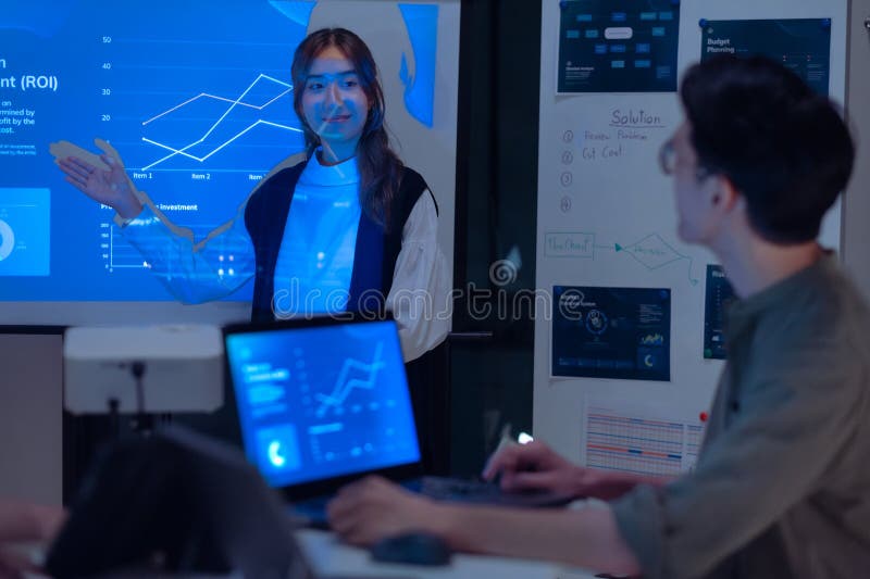 Asian Leader Present Business Presentation in a Dimly Lit Office ...