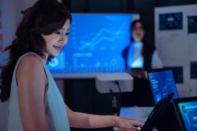 Asian Leader Present Business Presentation in a Dimly Lit Office ...