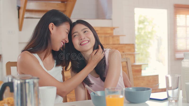 Asian Lgbtq Women Talking And Sitting Dance Cheerfully On The Couch
