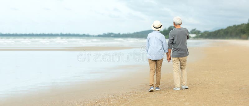 Asian Lifestyle Senior Couple Walking Chill On The Beach Happy In Love