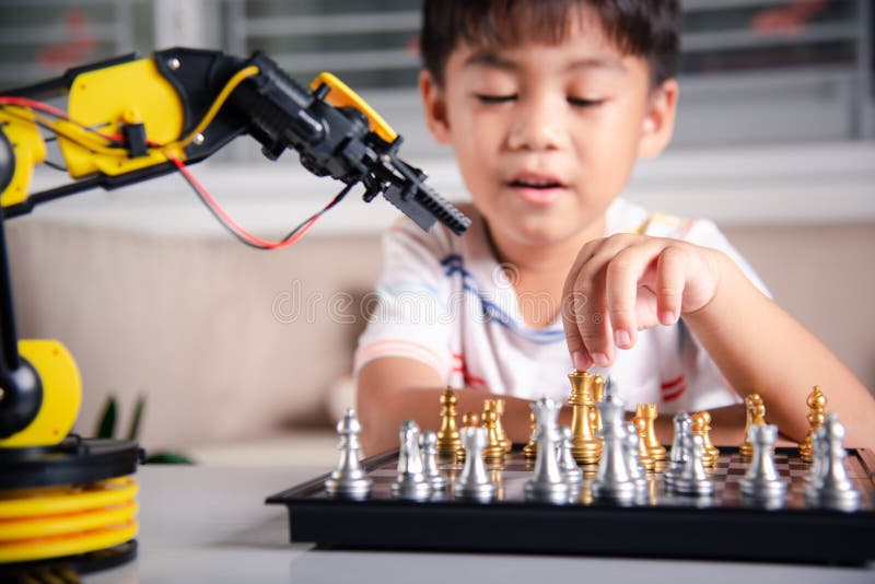 Asian Little Boy is Playing Chess with Robot Machine Arm Stock Image ...