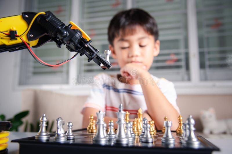 Asian Little Boy Thinking and Wait Robot Arm Playing Chess Stock Image ...