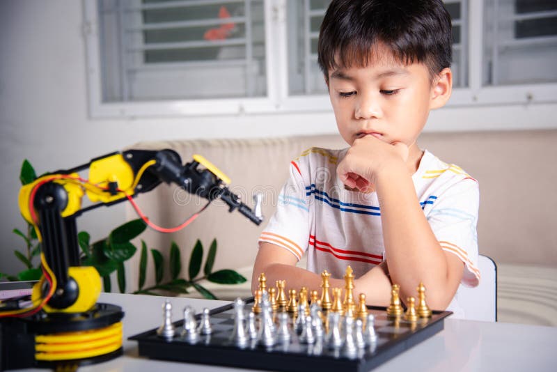 Asian Little Boy is Playing Chess with Robot Machine Arm Stock Photo ...