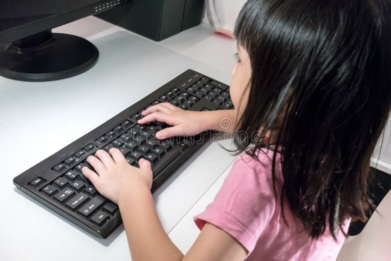 Asian Little Girl Practicing Computer Keyboard Typing Stock Image ...