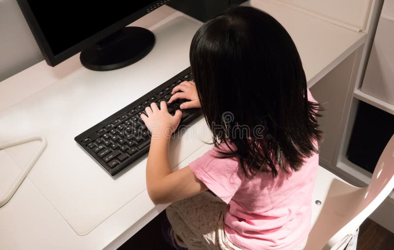 Asian Little Girl Practicing Computer Keyboard Typing Stock Image ...