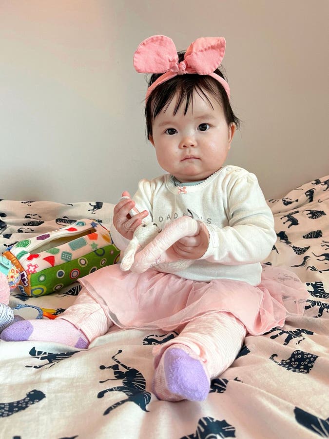 Asian Little Girl Sitting on Bed Stock Photo - Image of dreamy ...