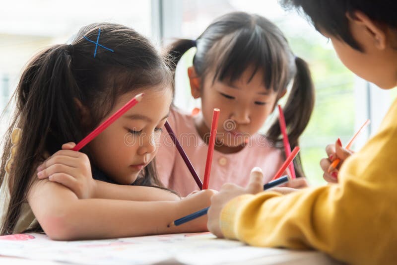 Asian Little Kids are Colouring in a Classroom. Stock Photo - Image of ...