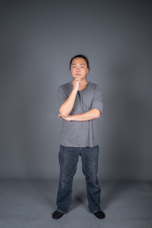 Asian Long Hair Friendly and Positive Man is Posting and Standing in ...