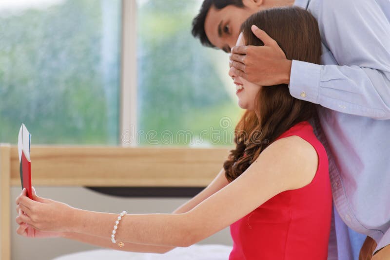 Asian Lovely Handsome Husband Surprise Beautiful Happy Smiling Wife By Closed Eyes And Give