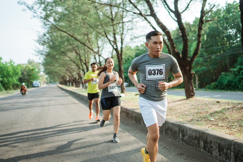 Asian Male Athlete Running Marathon Track Stock Photo - Image of event ...
