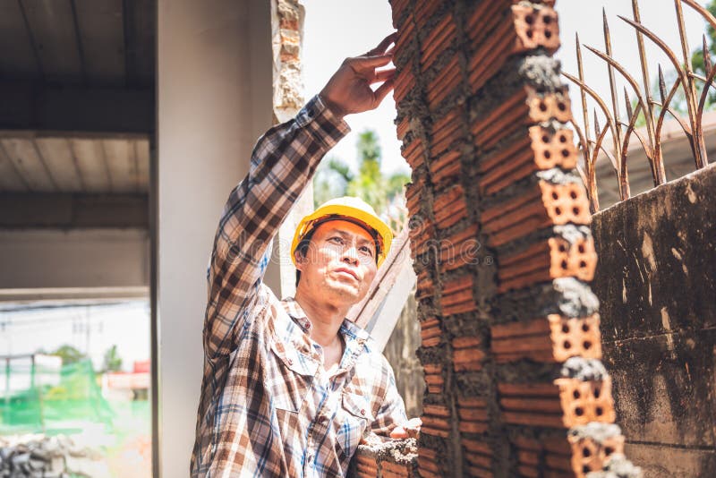 Asian Male Construction Engineer Checking the Orderliness of the Brick ...