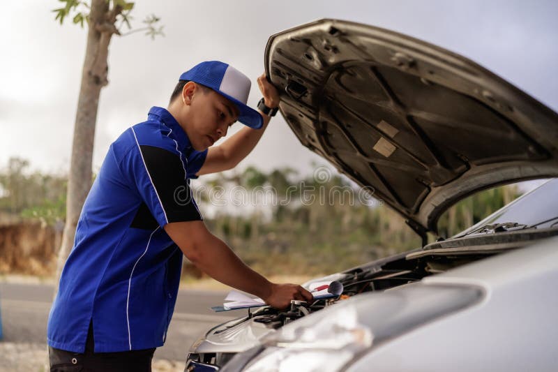 Asian Male Engineer Inspecting Car Engine Stock Photo - Image of ...