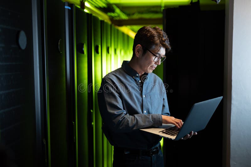 Asian Male Engineer Using Laptop in Computer Server Room Stock Image ...