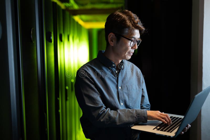 Asian Male Engineer Using Laptop in Computer Server Room Stock Image ...