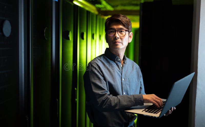Asian Male Engineer Using Laptop in Computer Server Room Stock Photo ...