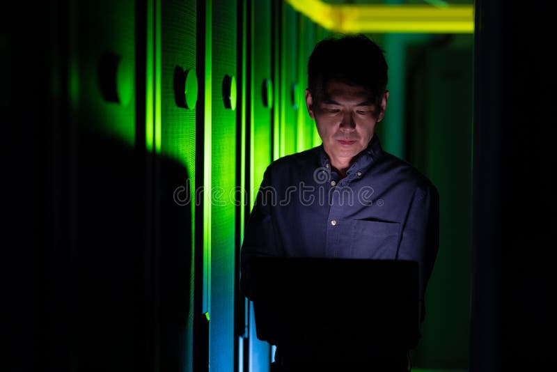Asian Male Engineer Using Laptop in Computer Server Room Stock Photo ...