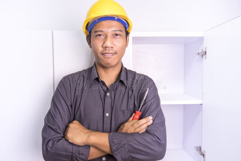 The Chief Engineer is Checking the Integrity of the Cabinet Door Repair ...