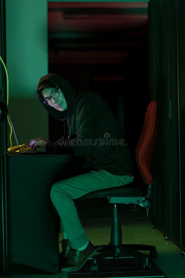Asian Male Hacker Using a Laptop in Computer Server Room Stock Image ...