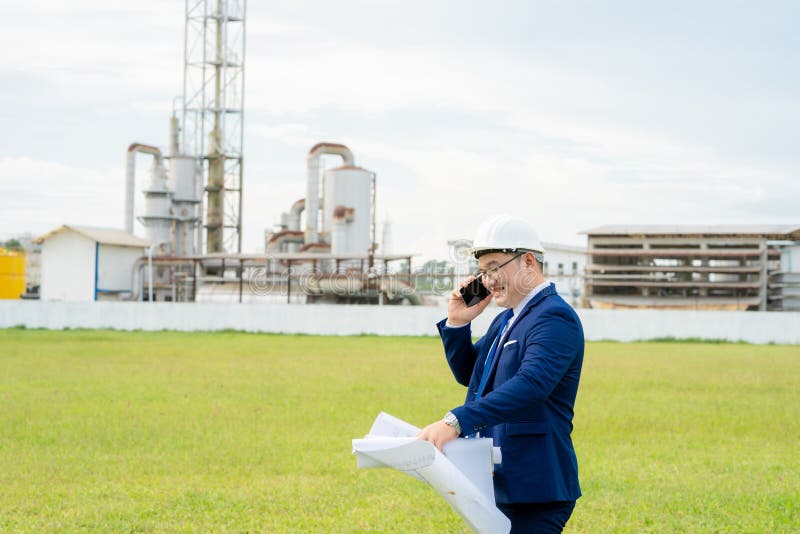 Asian Male Manager Standing in Front of the Factory Holding a Work Plan ...