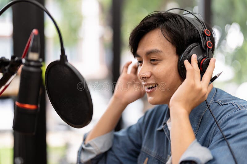 Asian Male Podcaster Making Audio Podcast from Her Home Studio Stock ...