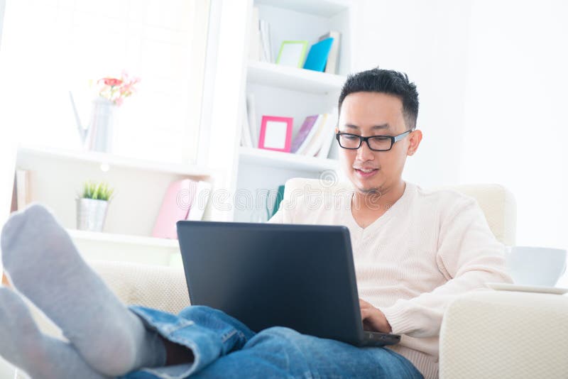Asian Male Using Internet at Home Stock Image - Image of male ...