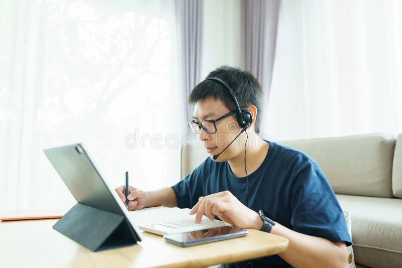 Asian Man Aged 30-40 Years Using Tablet, Watching Lesson Online Course ...